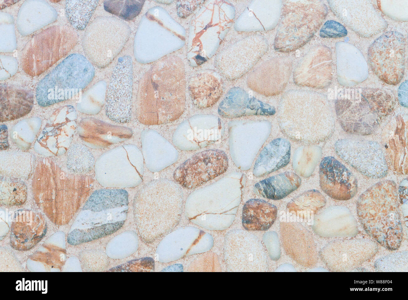 The texture of the colored stone in the form of tiles on the street ...