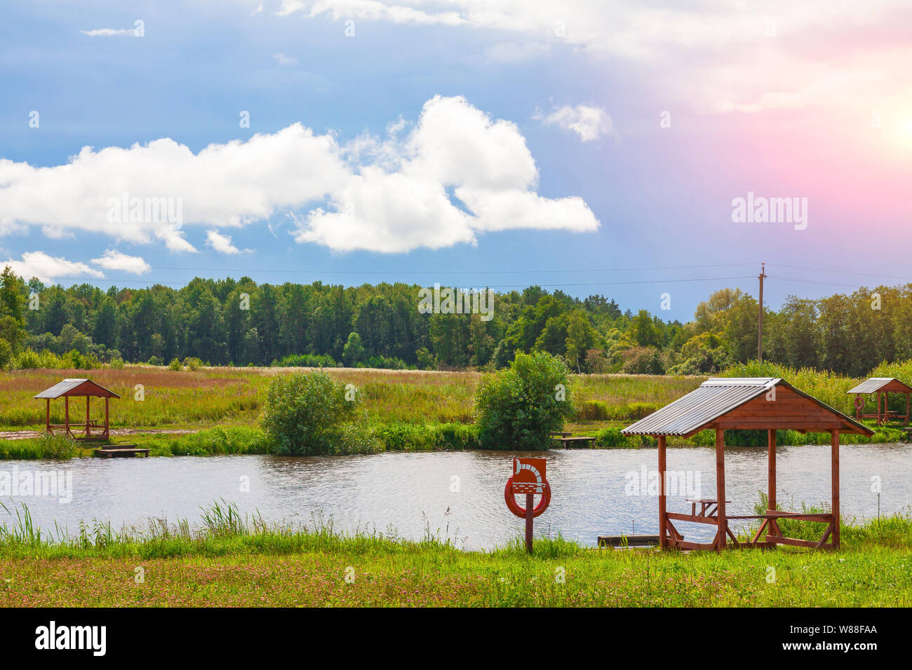 Summer day at the fishing pond Stock Photo - Alamy