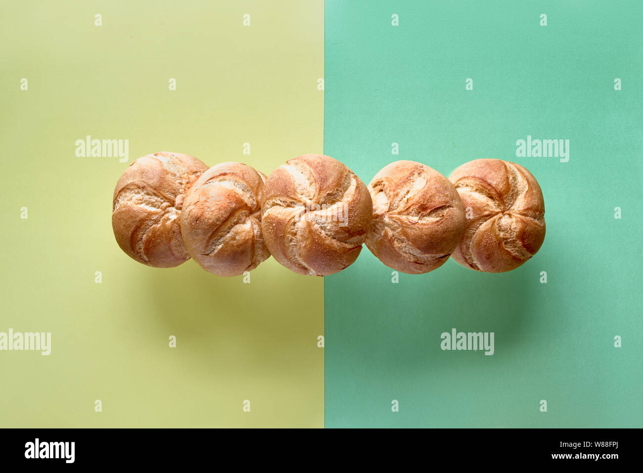 Crusty round bread rolls, known as Kaiser or Vienna rolls, on split ...