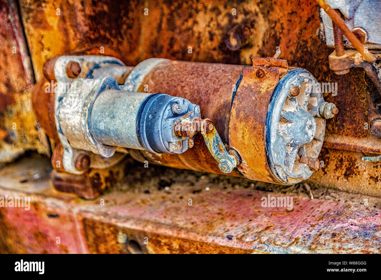 Close-up view of rusted starter on an abandoned tractor Stock Photo - Alamy