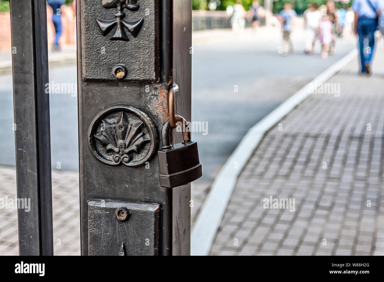 Metal lock on the old metal gate Stock Photo - Alamy