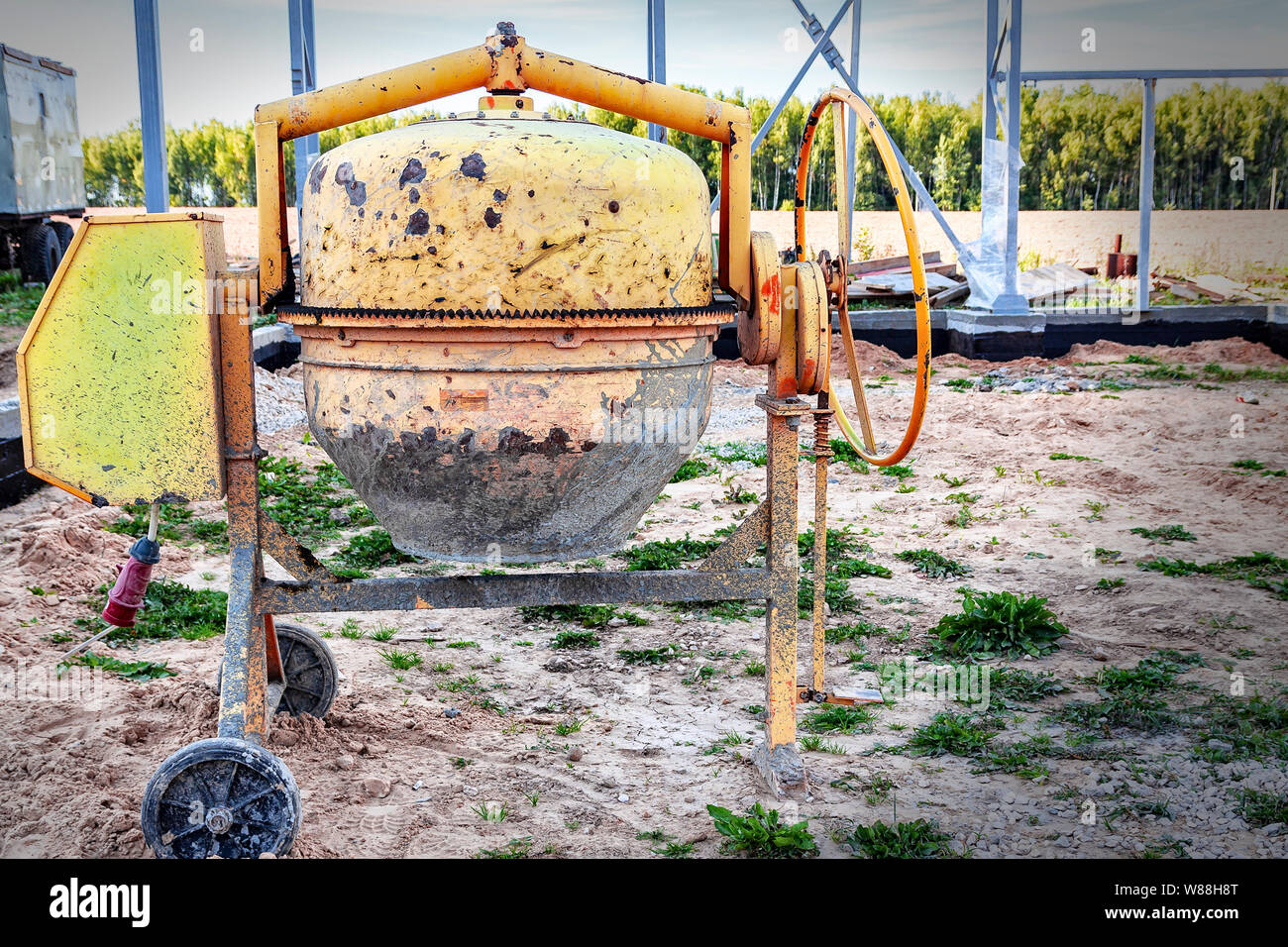 Yellow concrete mixer. 3D rendering, is at the construction site Stock ...