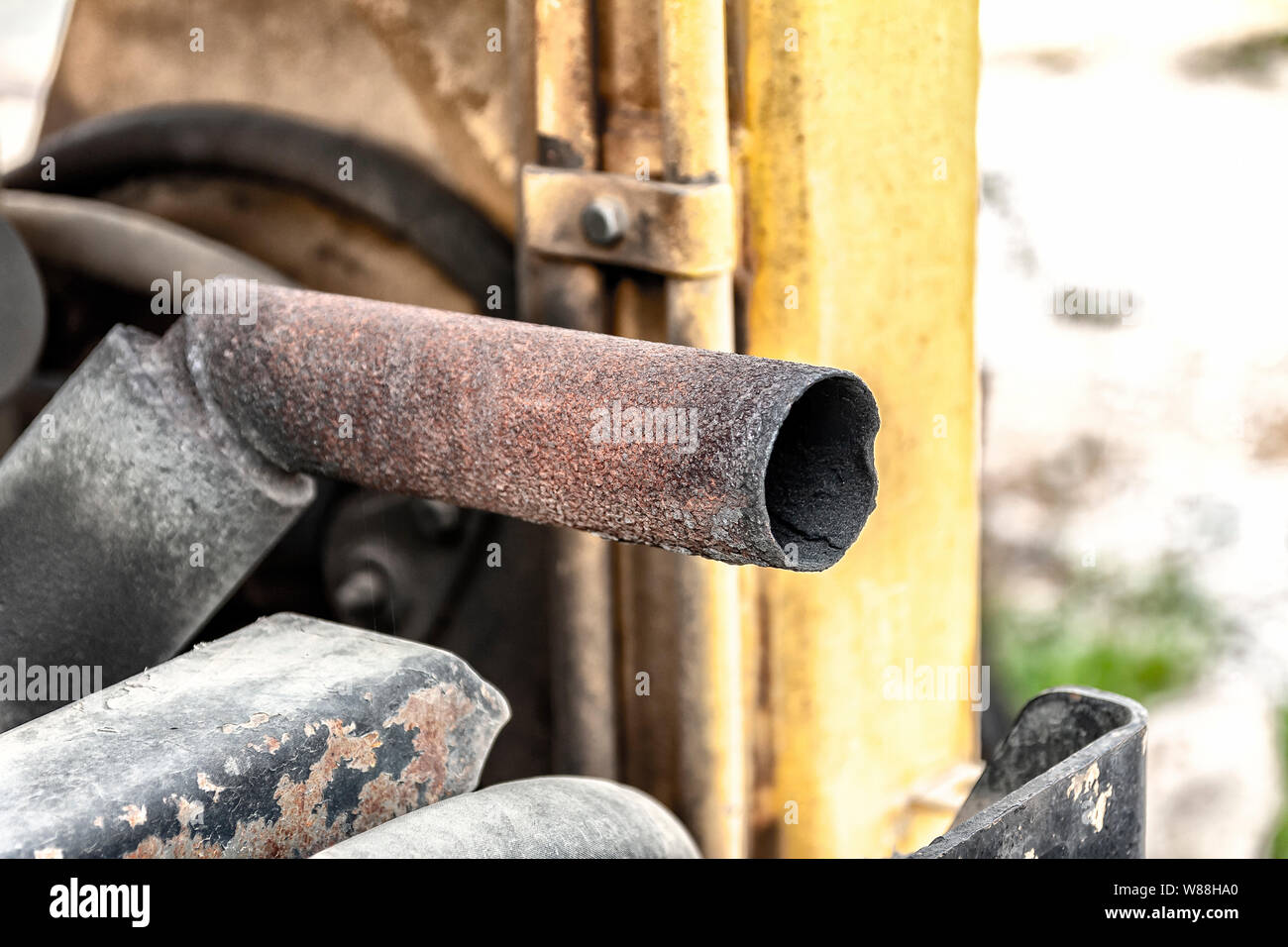 Old rusty steel exhaust pipe on an excavator tractor Stock Photo - Alamy