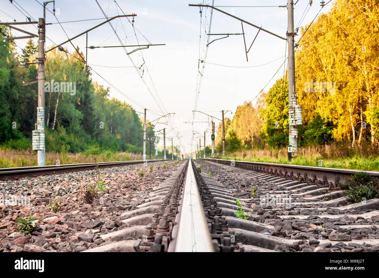 Early morning on the railway tracks for an electric train Stock Photo ...