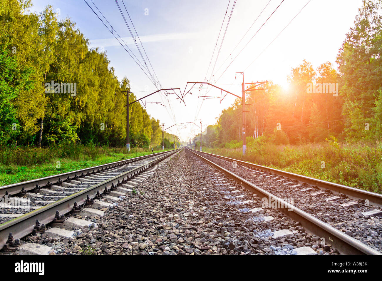 Early morning on the railway tracks for an electric train Stock Photo ...