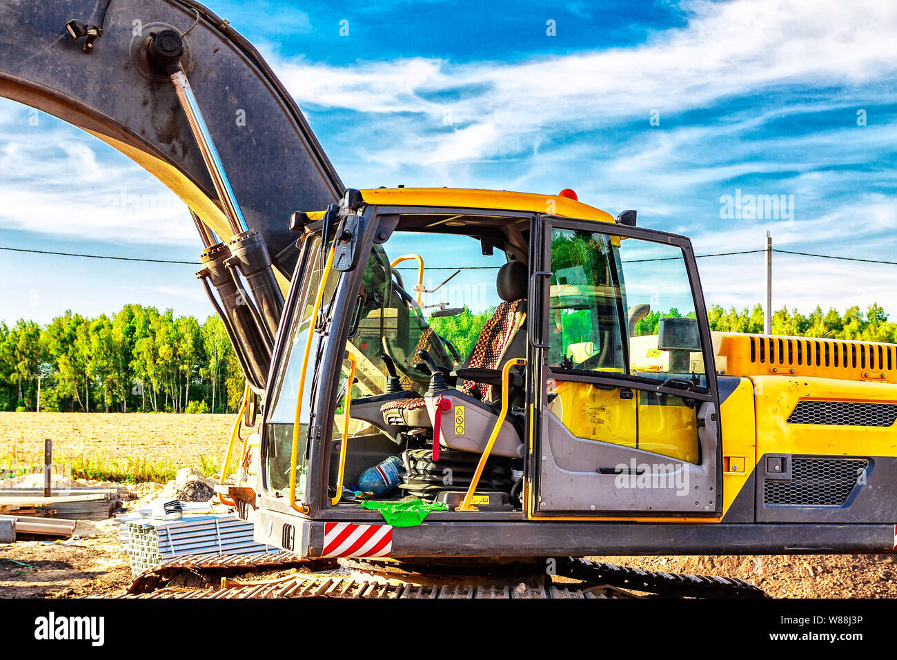 Excavator cab, which stands on the construction site Stock Photo - Alamy
