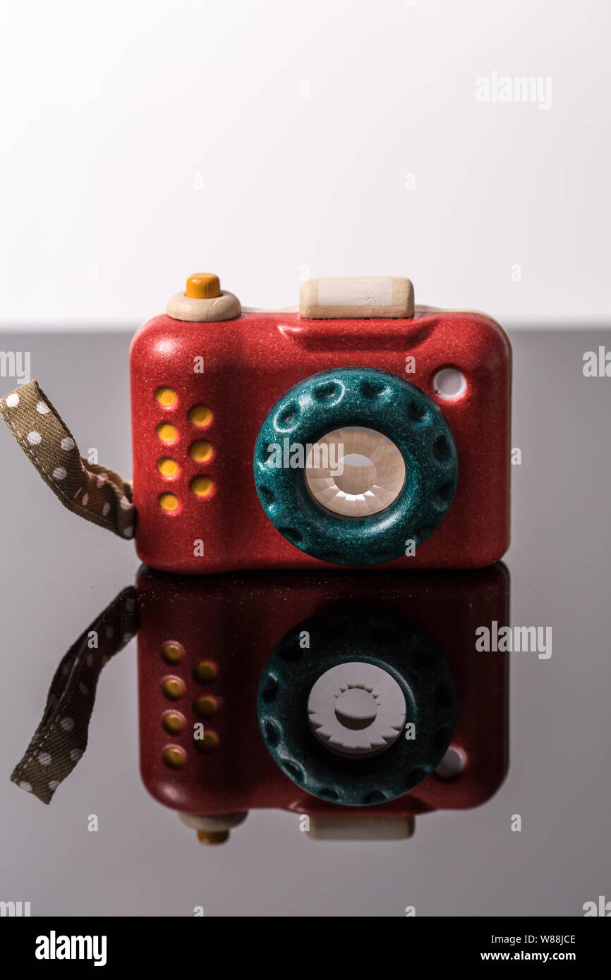 Red toy handmade wooden photography camera Stock Photo - Alamy