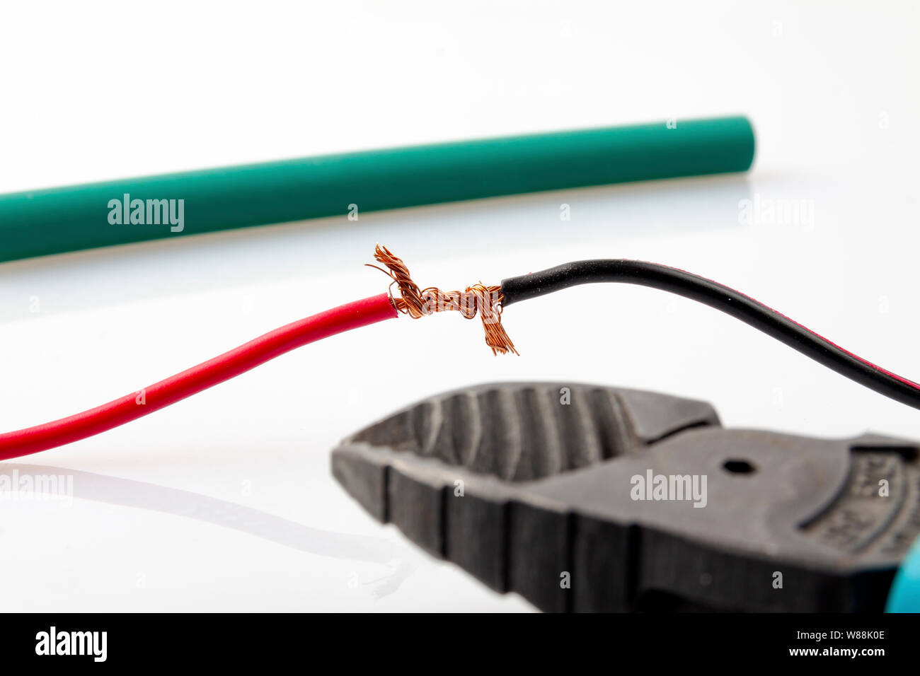 Twisting the two wires, side cutters are located side by side, all on a ...
