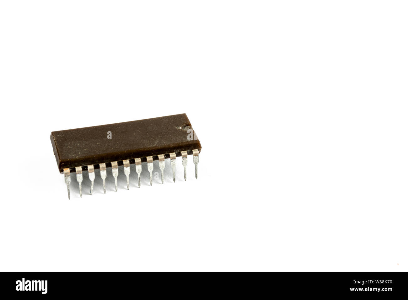 Very old computer chip isolated on a white background Stock Photo - Alamy