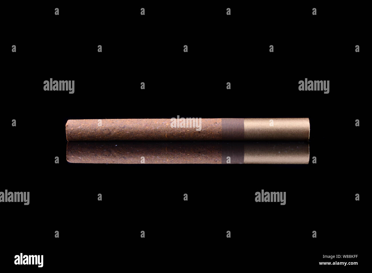 Cigar with reflection isolated on black background Stock Photo - Alamy