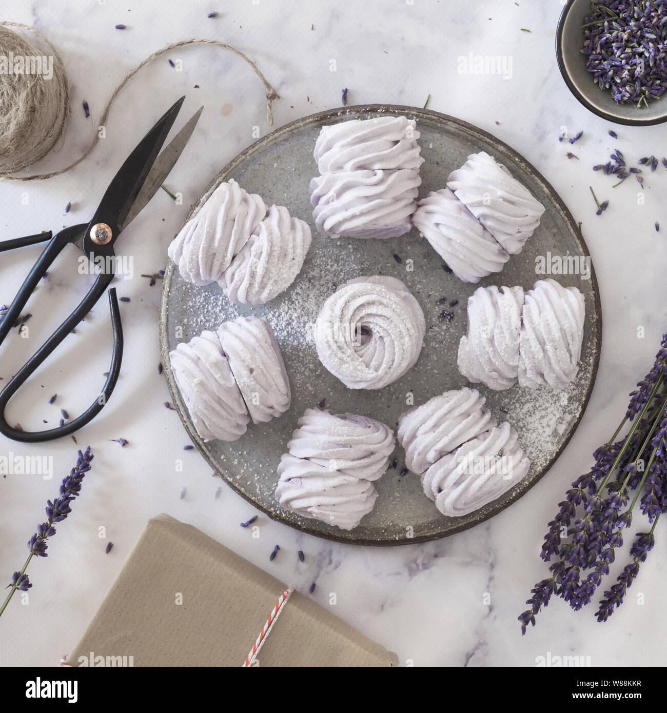 Flat lay with a plate of home-made marshmallows (zephyr, meringue) made ...