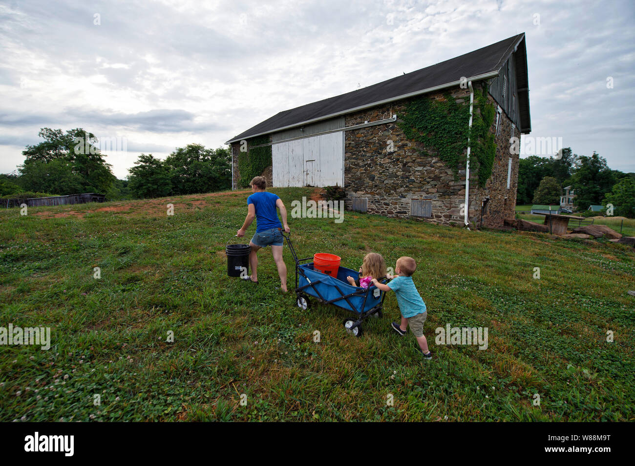UNITED STATES - June 7, 2019: Doolan, Mabel, and Molly Kroiz head out ...