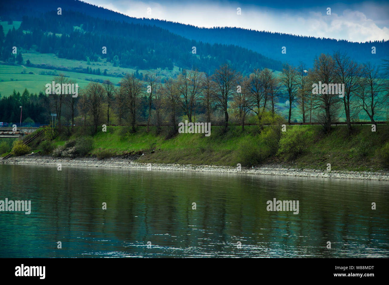 colorful trees and lake scene background Stock Photo - Alamy