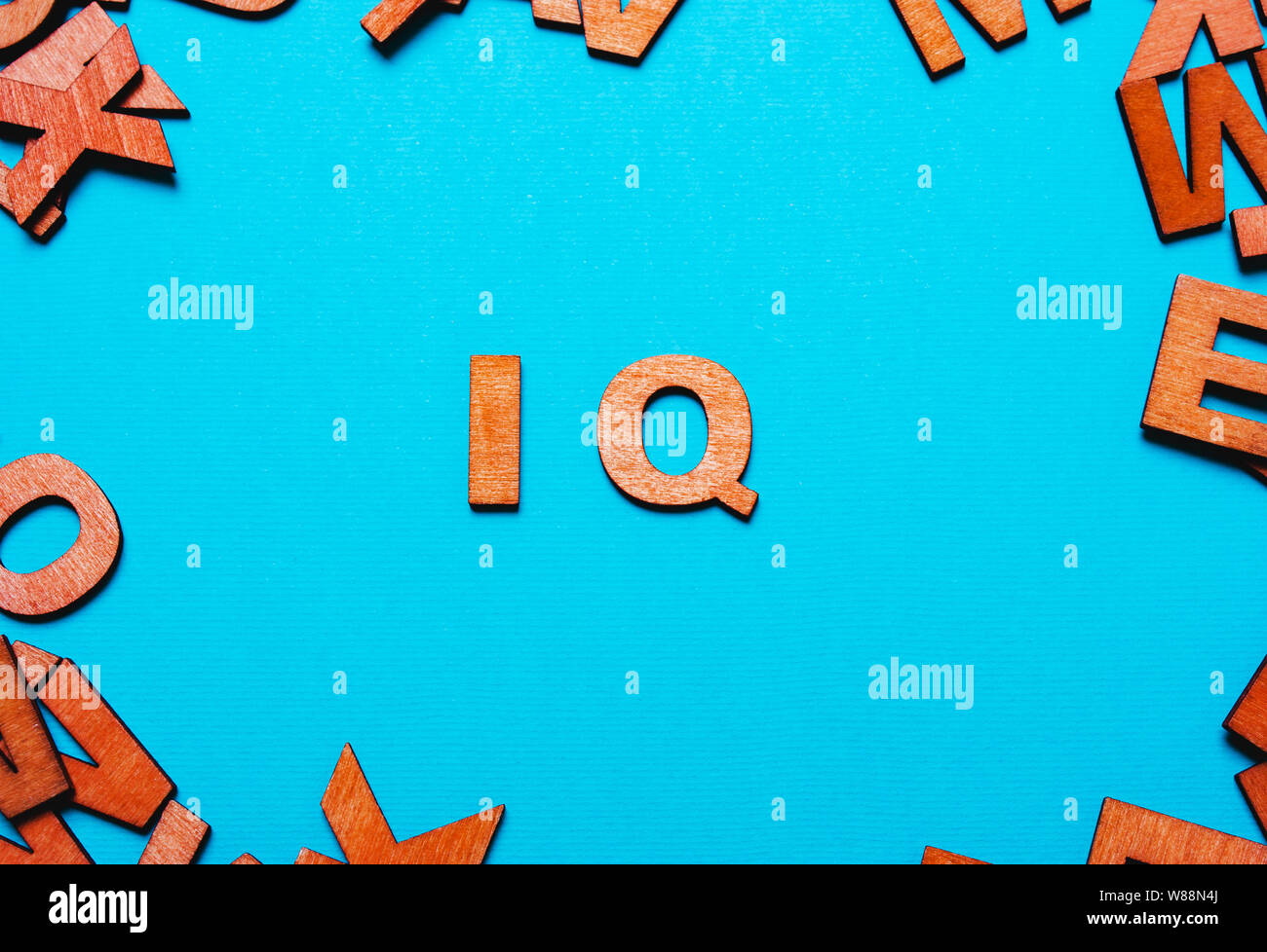 Word ,abbreviation IQ of wooden letters on a blue background Stock ...