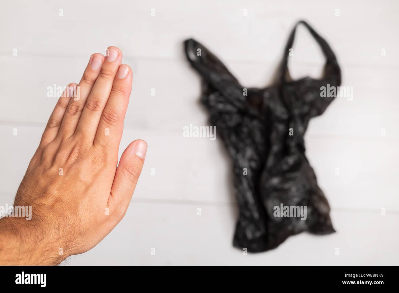 Say no plastic bag concept. Man says no to plastic bag. Zero waste ...