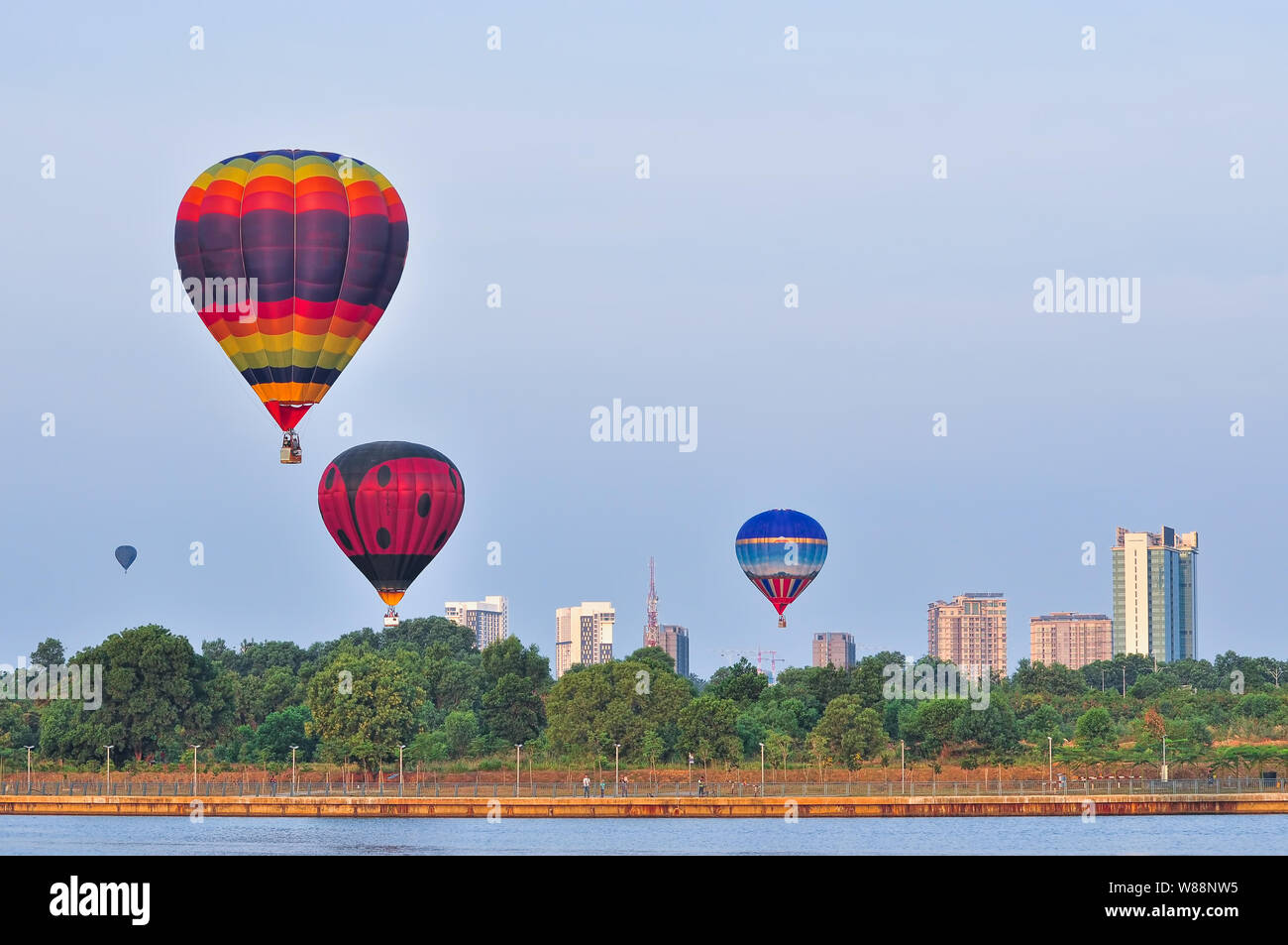 Colorful Hot Air Balloons in Flight over blue sky Stock Photo - Alamy