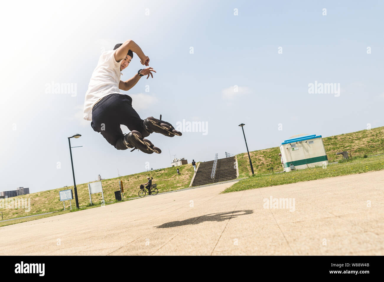 Japanese skater Kenji Akiyama showing his jumping skills Stock Photo ...