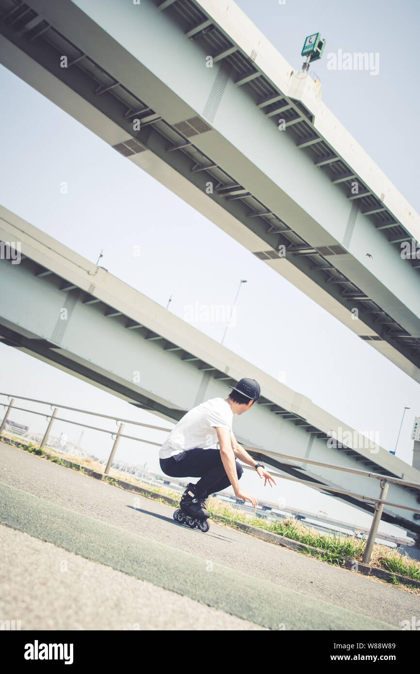 Japanese skater Kenji Akiyama showing his jumping skills Stock Photo ...