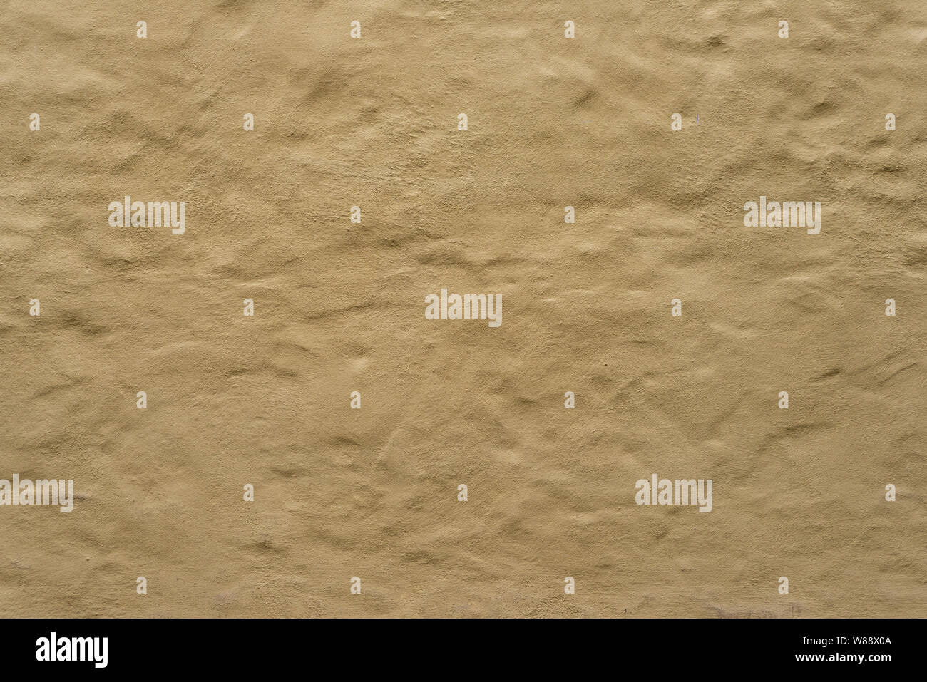 Rough bumpy brown yellow concrete plaster stucco texture or surface ...