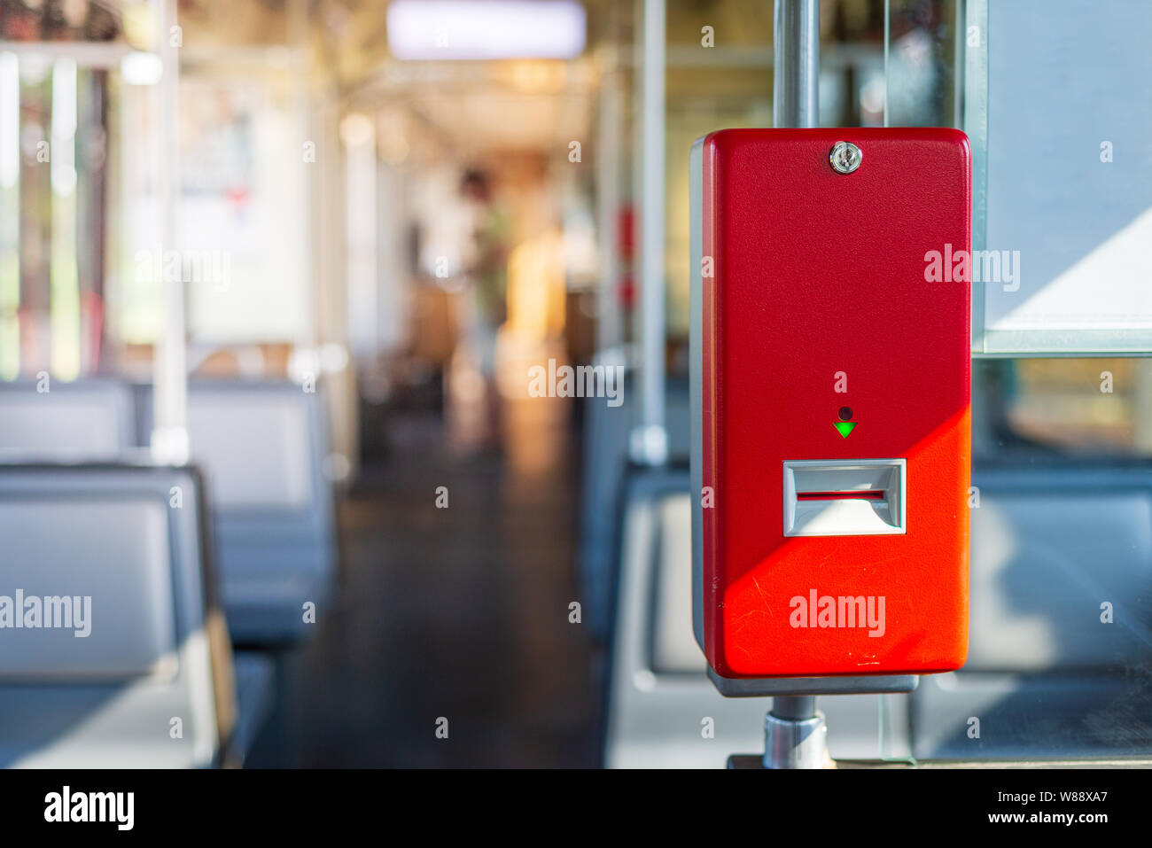 Selected focus of Red public transportation ticket stamp or validation ...