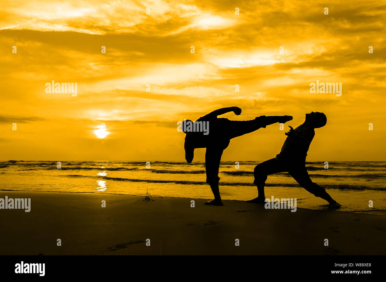 Fighting an enemy near the beach when the sun rising up Stock Photo - Alamy