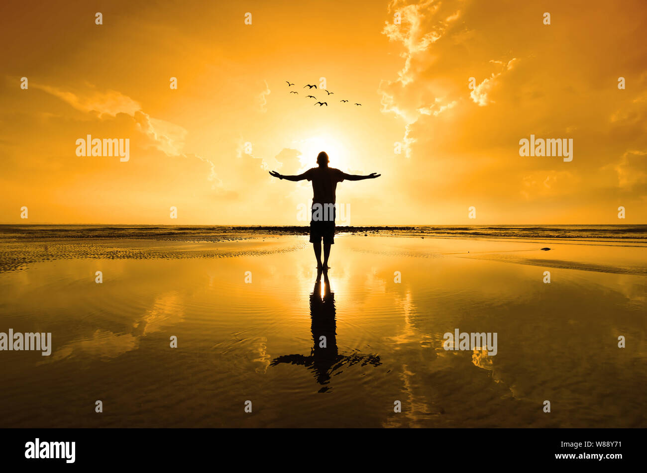 Silhouette of Man Raising His Hands or Open arms when sun rising up ...