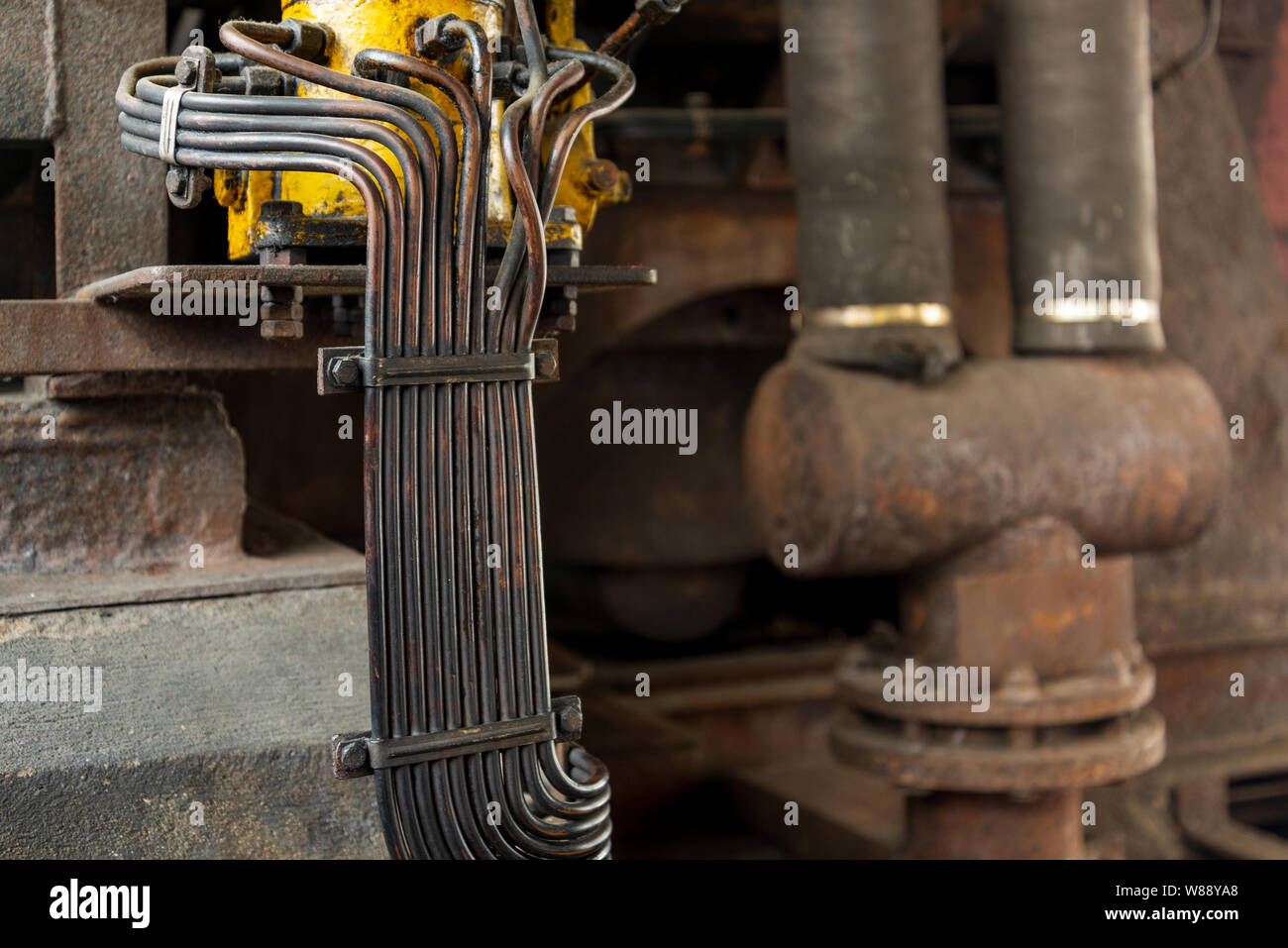 Close up view of old rusty machine with complex vault, pipeline and ...