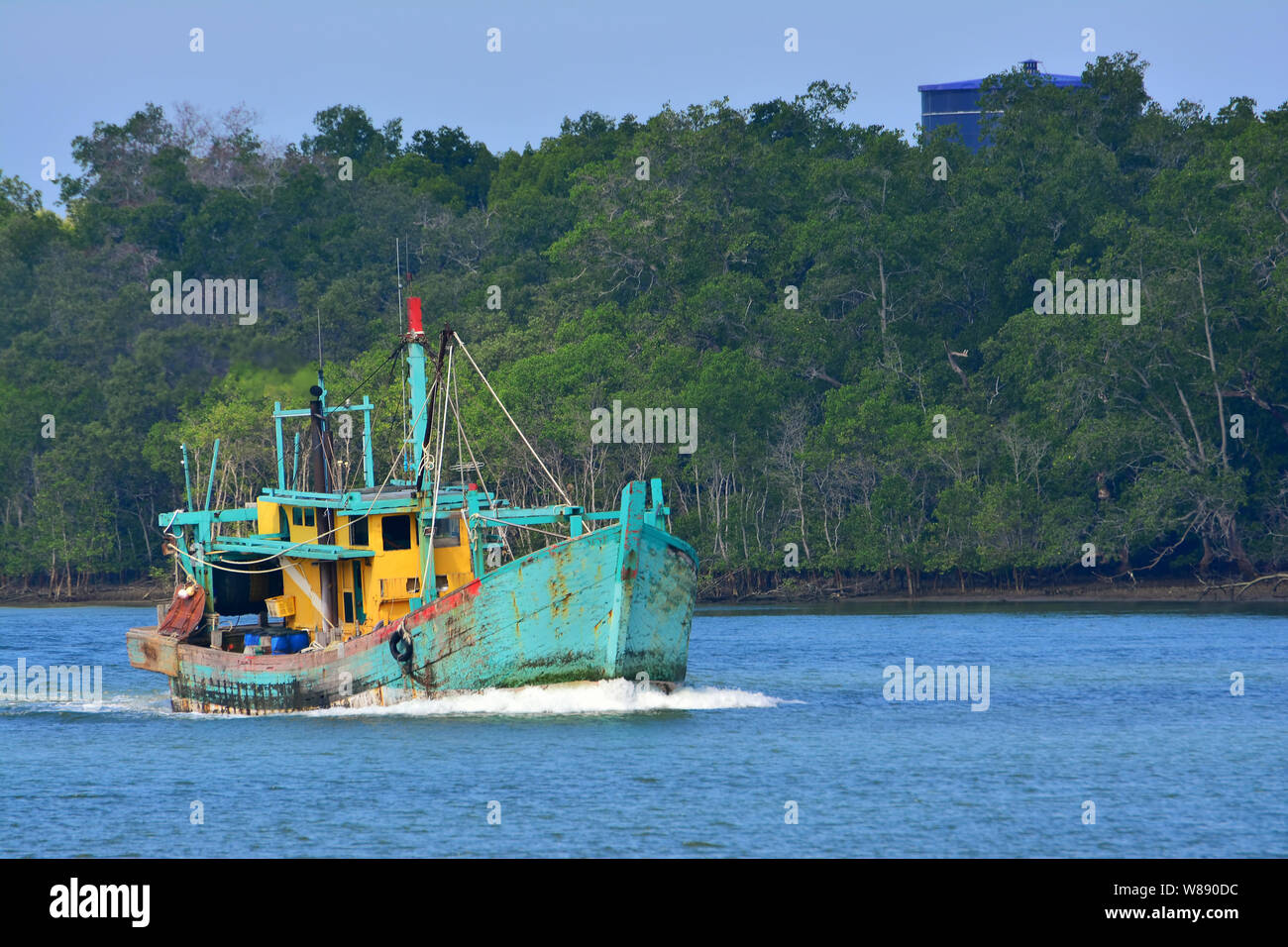 An old, rusty fishing trawler returning to harbor Stock Photo - Alamy
