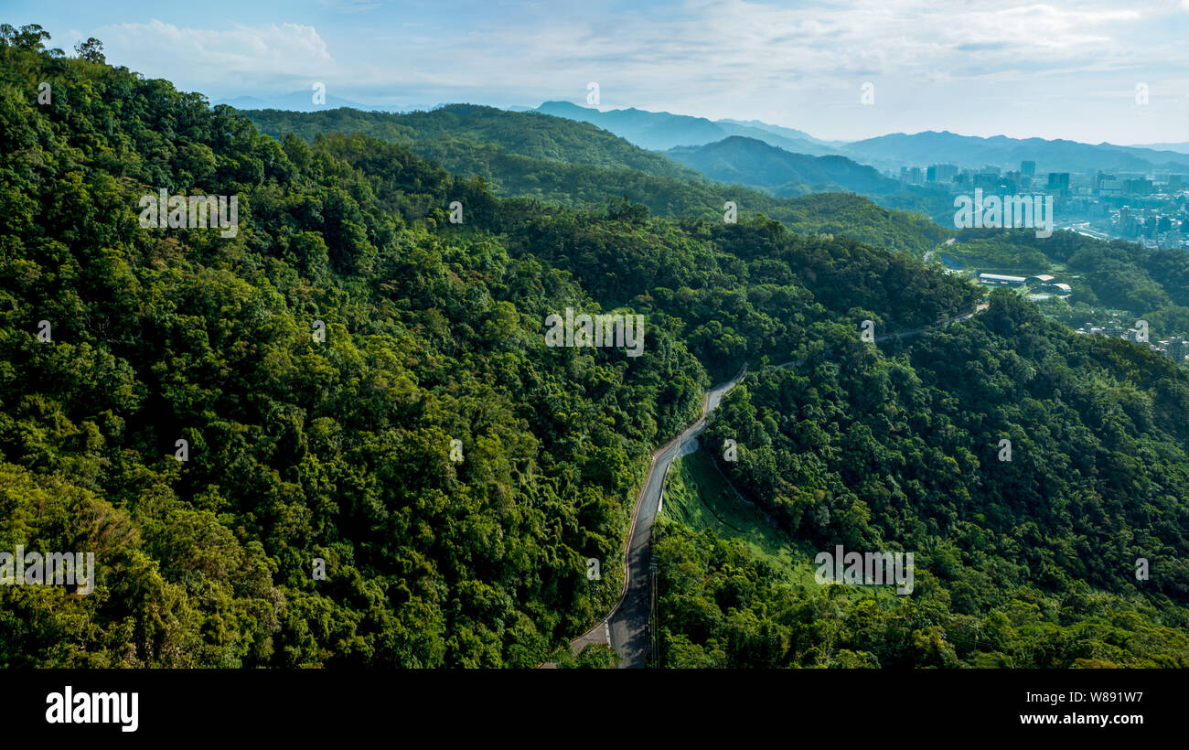 Aerial view of road through jungle hi-res stock photography and images ...