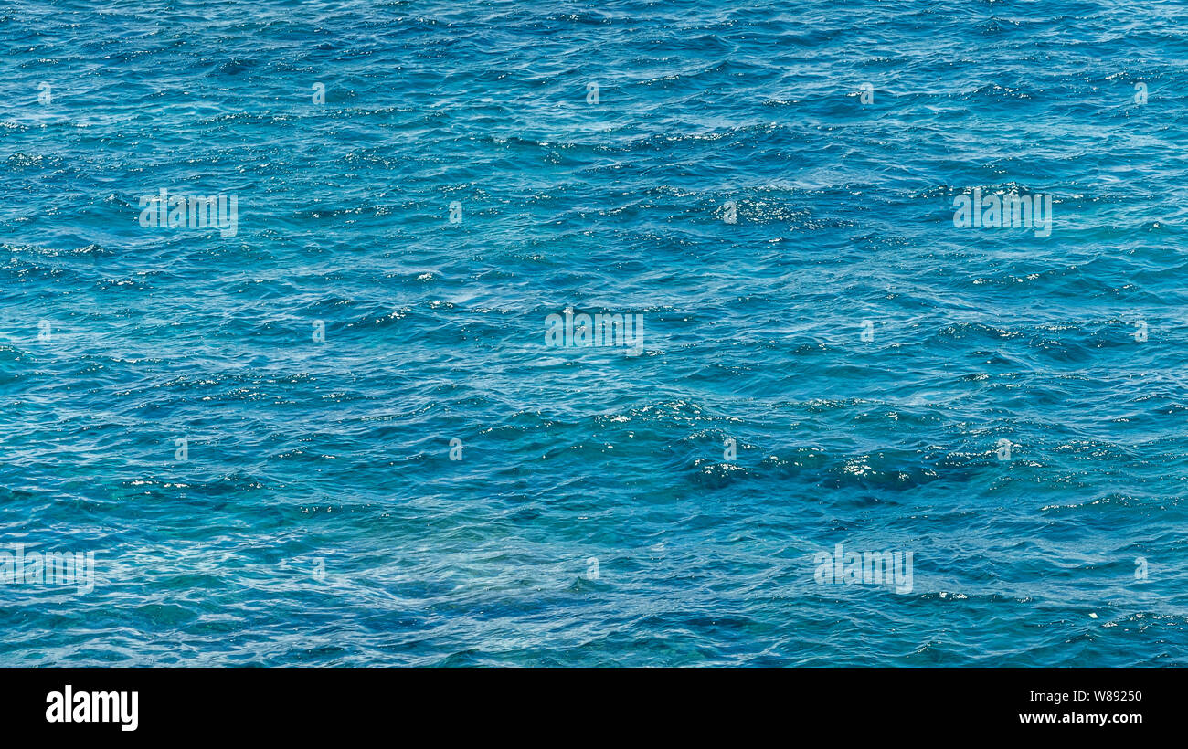Natural blue sea surface. Beauty ocean water background. Sea waves on ...