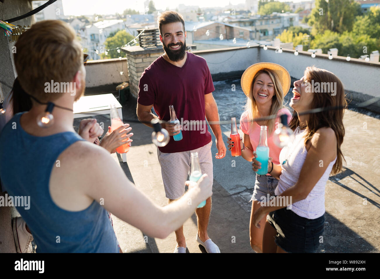 Having a great time with friends, havinf fun at rooftop party Stock ...
