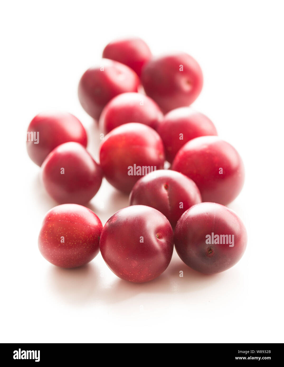 The red cherry plums fruit isolated on white background Stock Photo - Alamy