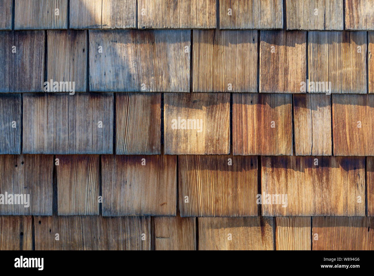 Rough bumpy wood shingle cladding, row of wooden material of small ...