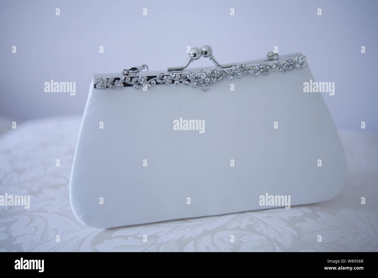 Silver satin clutch hi-res stock photography and images - Alamy