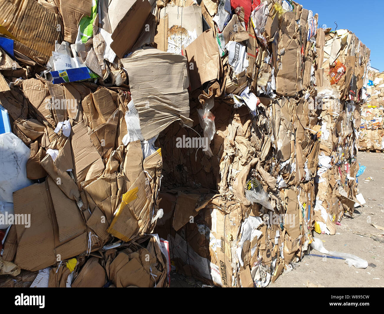 Stack of paper and cardboard garbage at recycling plan Stock Photo - Alamy