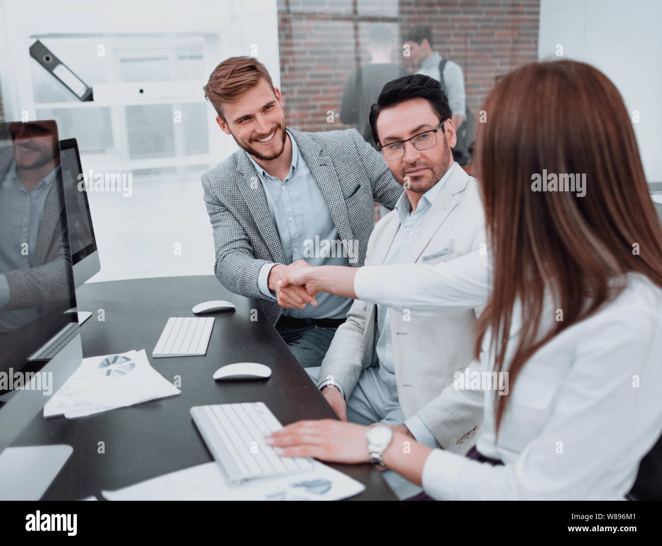 company employees discussing financial data Stock Photo - Alamy