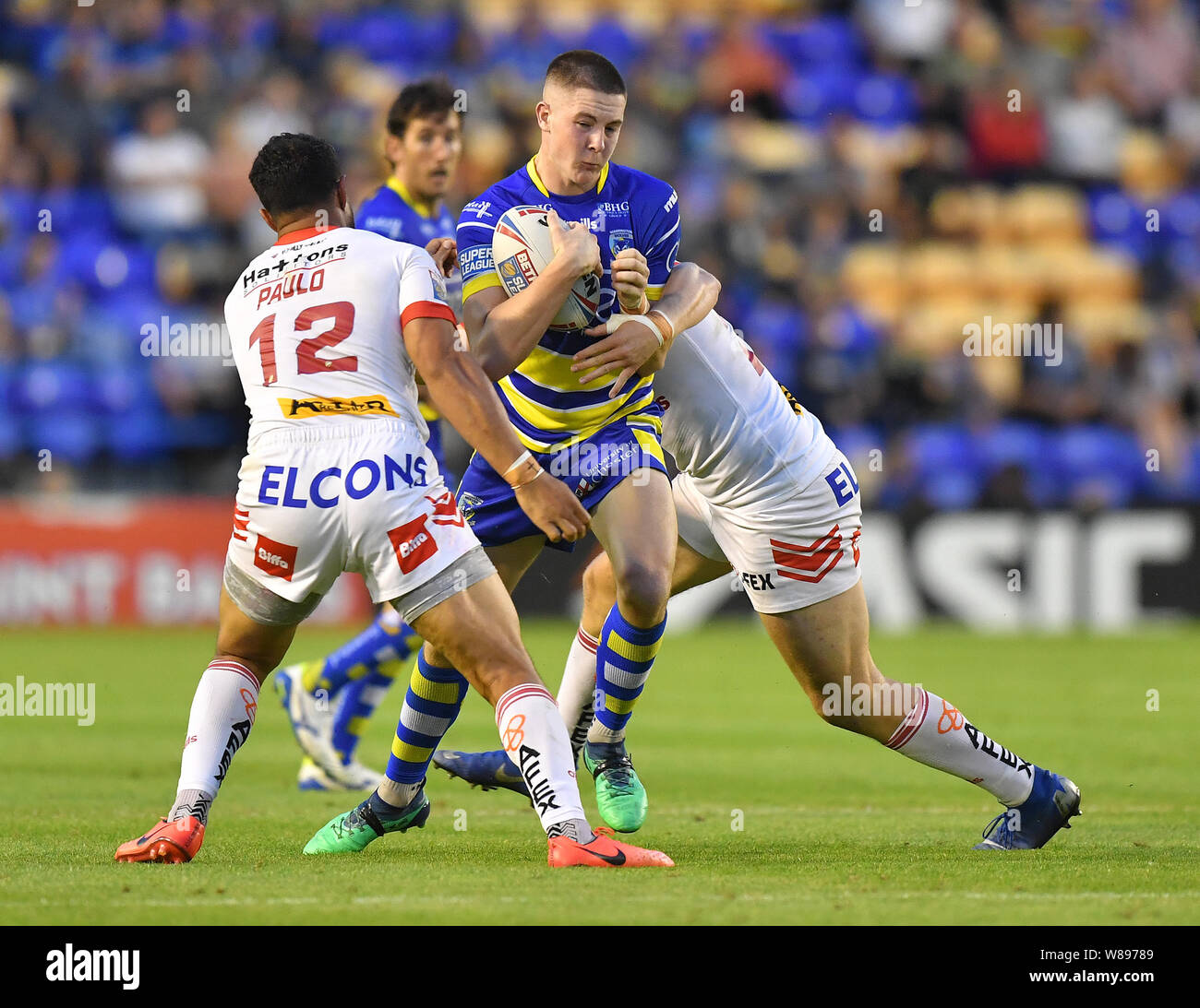 Warrington Wolves's Riley Dean is tackled by St Helens' Joseph Paulo ...