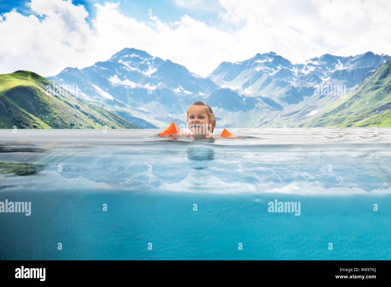 Children swimming in an infinity pool hi-res stock photography and ...