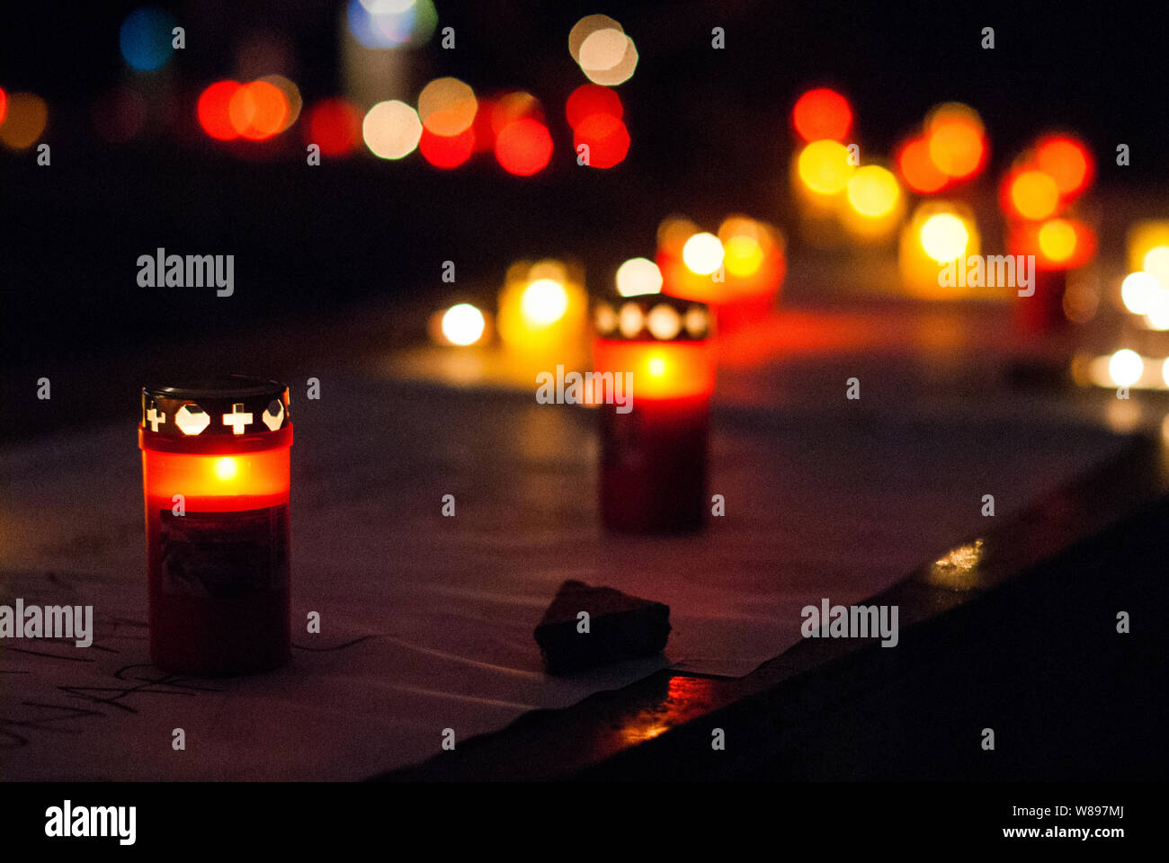 Many candles arranged next to each other, burning in the night Stock ...