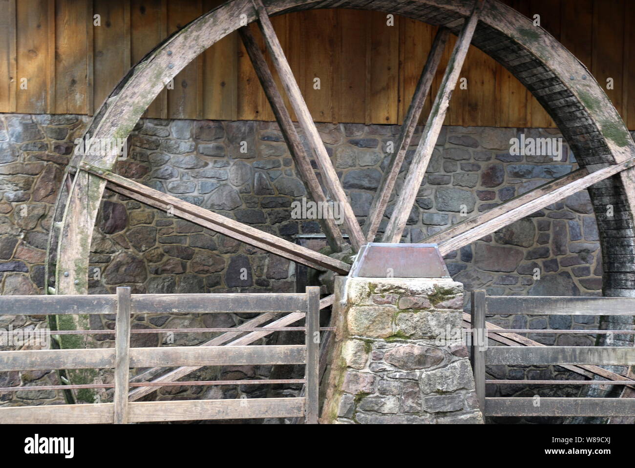 The wooden water wheel goes round and round Stock Photo - Alamy