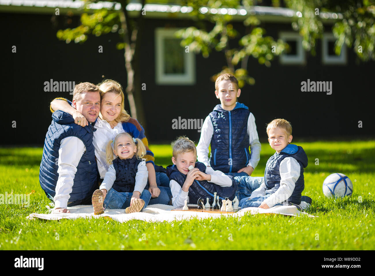 Big Family Relaxing In Green Nature. Happy family portrait on outdoor ...