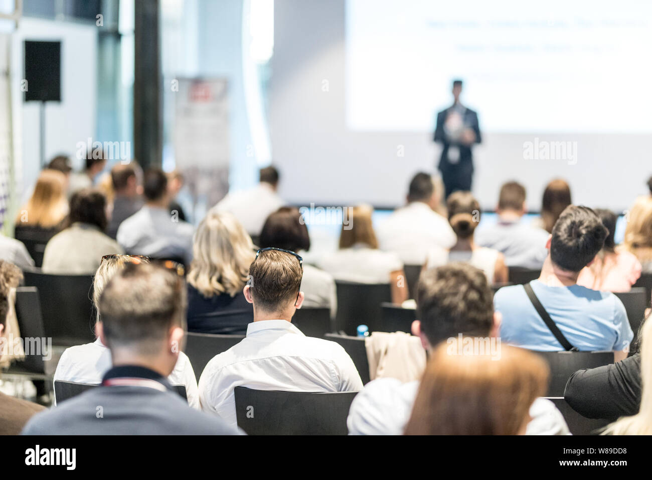 Male business speaker giving a talk at business conference event Stock ...