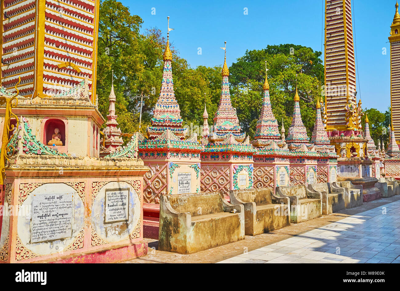 The line of carved burial stupas of Thanboddhay Pagoda, decorated with ...