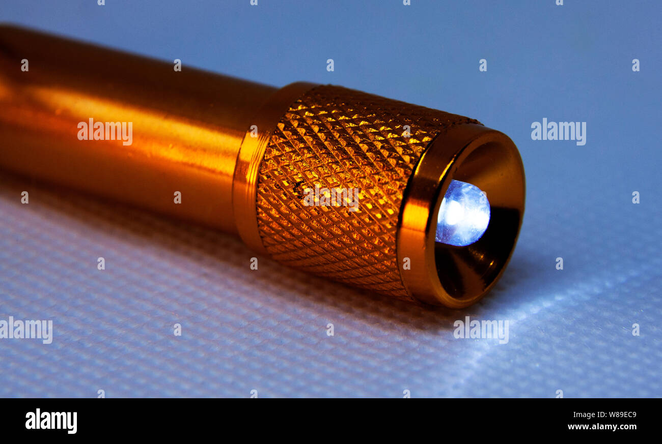 orange flashlight switched on in studio light Stock Photo - Alamy
