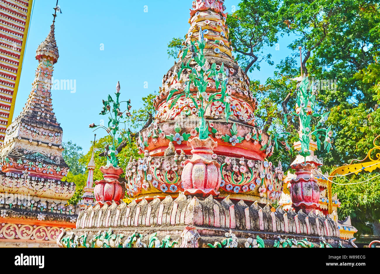 The bouquets with stucco flowers and carved floral decorations on mauve ...
