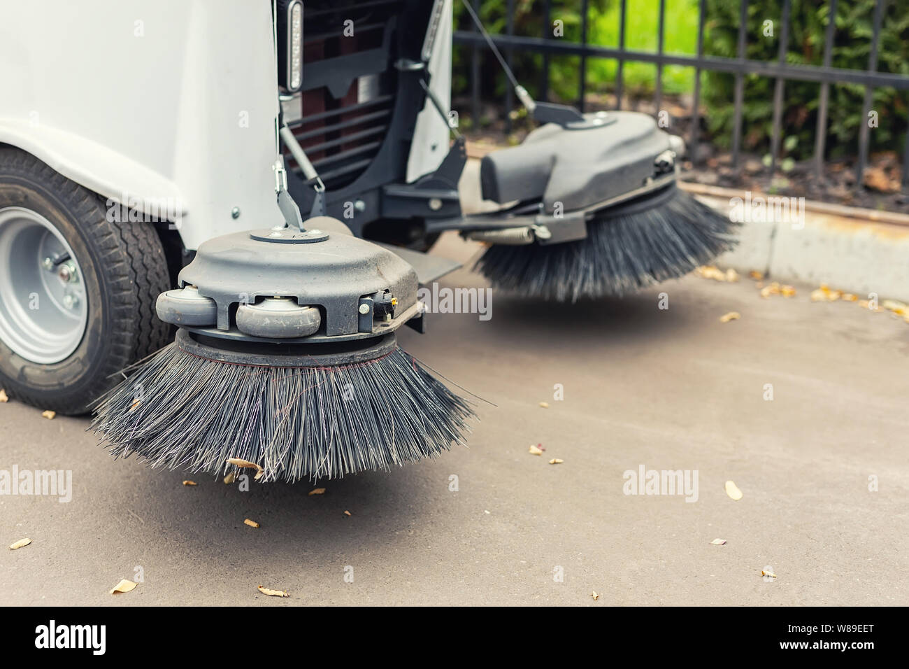 Small sweeper machine standing at parking storage after cleaning city ...