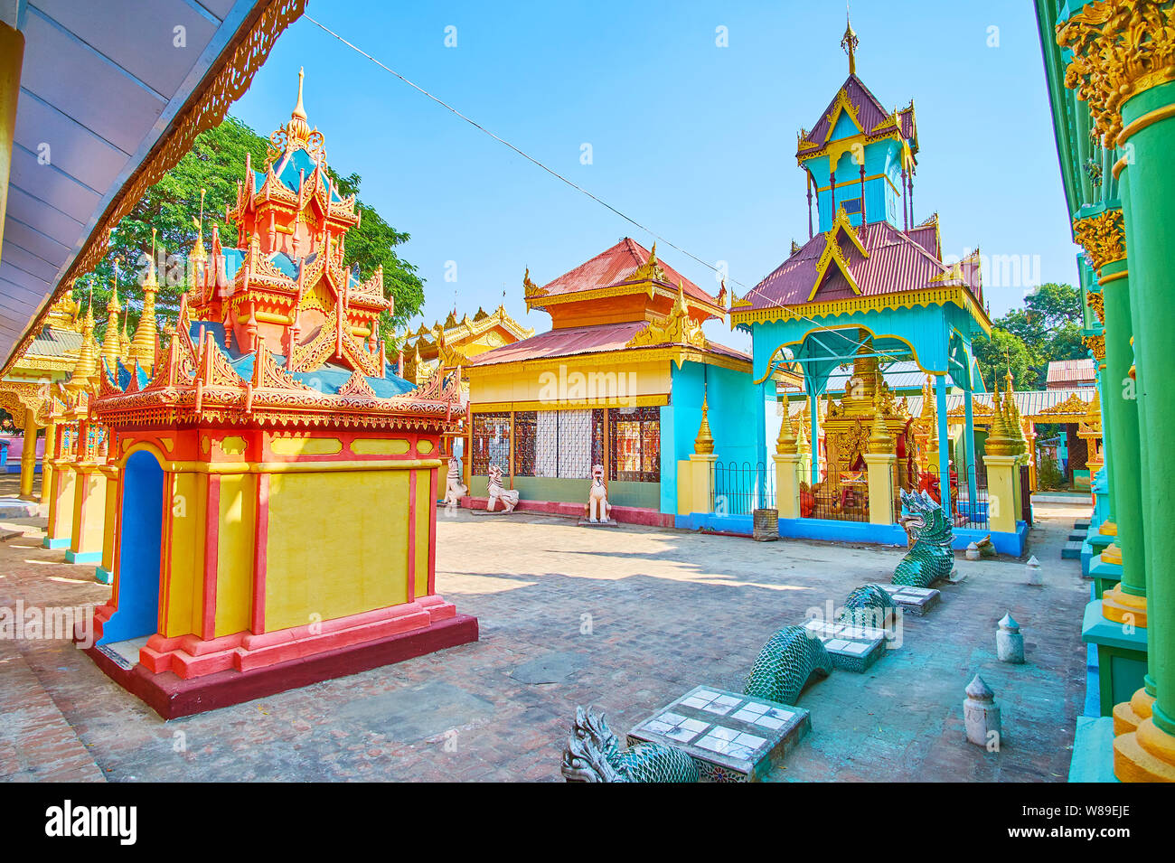 The beautiful shrines with bright walls, carved wooden pyatthat roofs ...