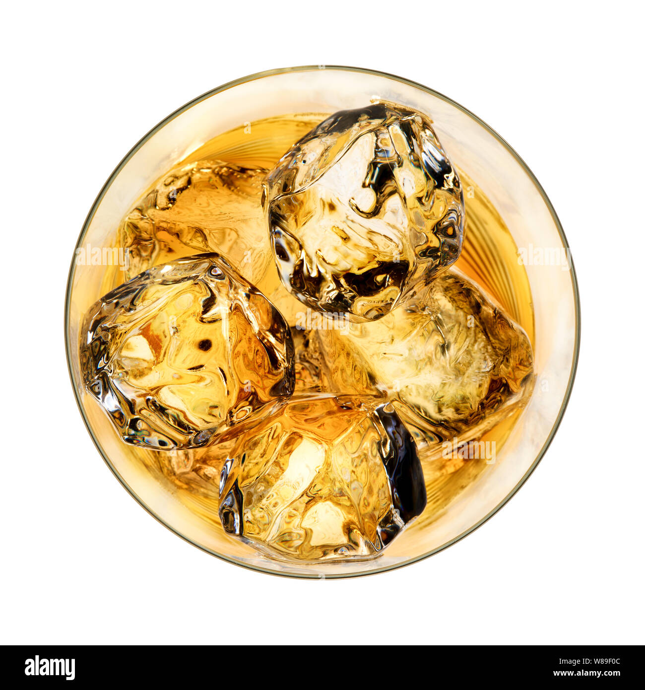 Glass of refreshing golden hard apple cider on the rocks. Closeup ...