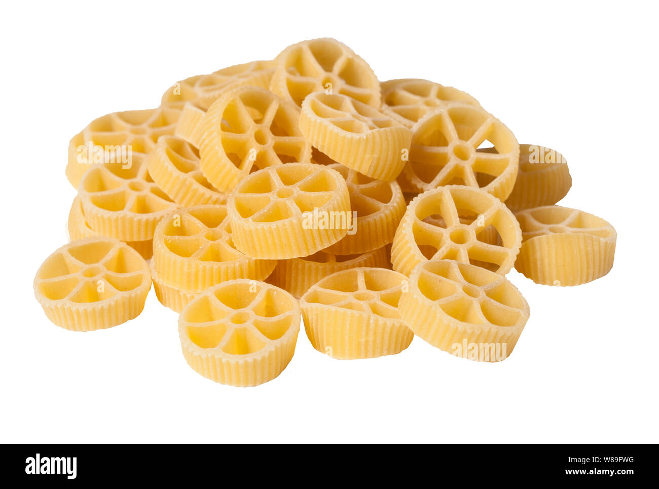 Wagon Wheels Pasta Pile Stock Photo - Alamy