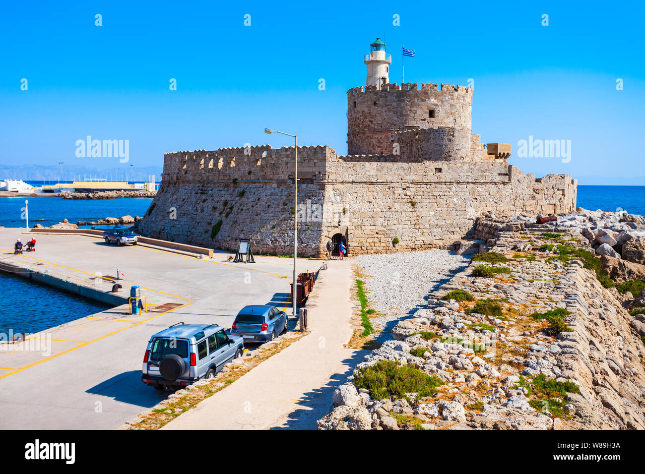 Saint Nicholas Fort at the Mandraki harbour in Rhodes city, capital of ...